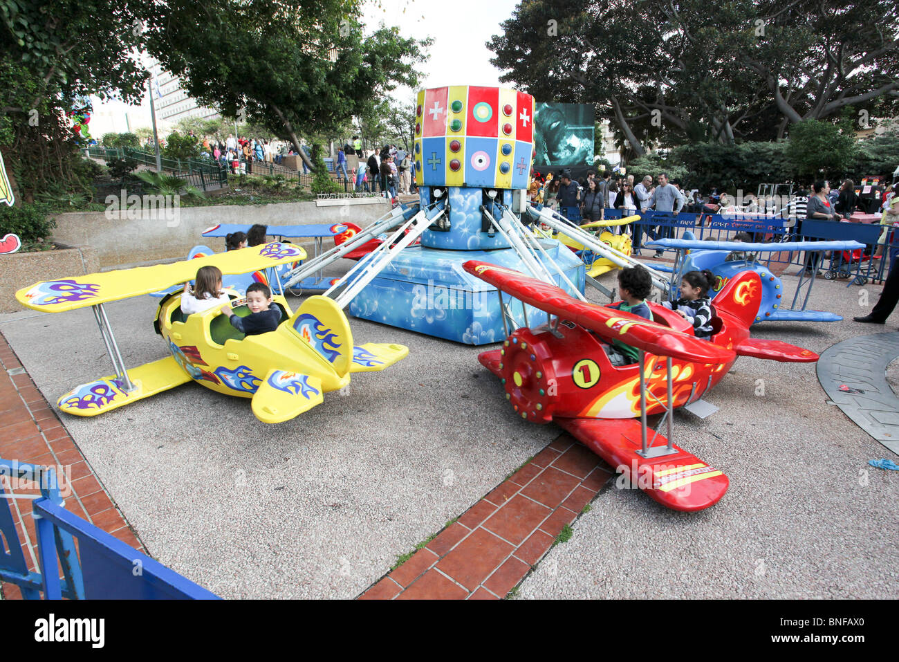 Children on a merry-go-round Stock Photo - Alamy