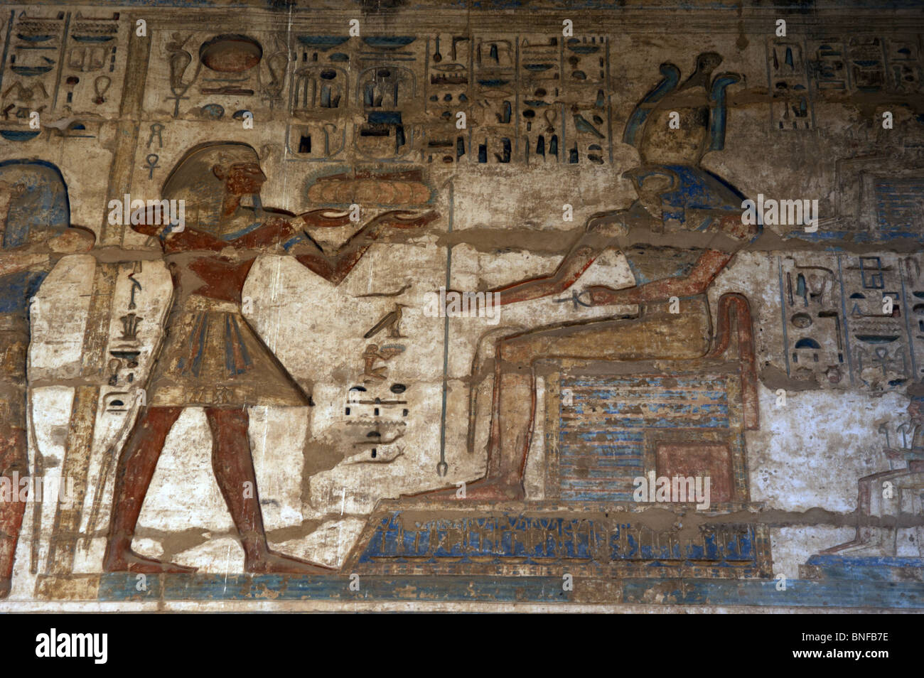 Temple of Ramses III. The pharaoh making offerings to god Horus. Egypt ...