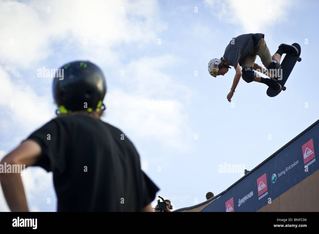 Professional Skateboarder jumping from a Half pipe structure Stock ...