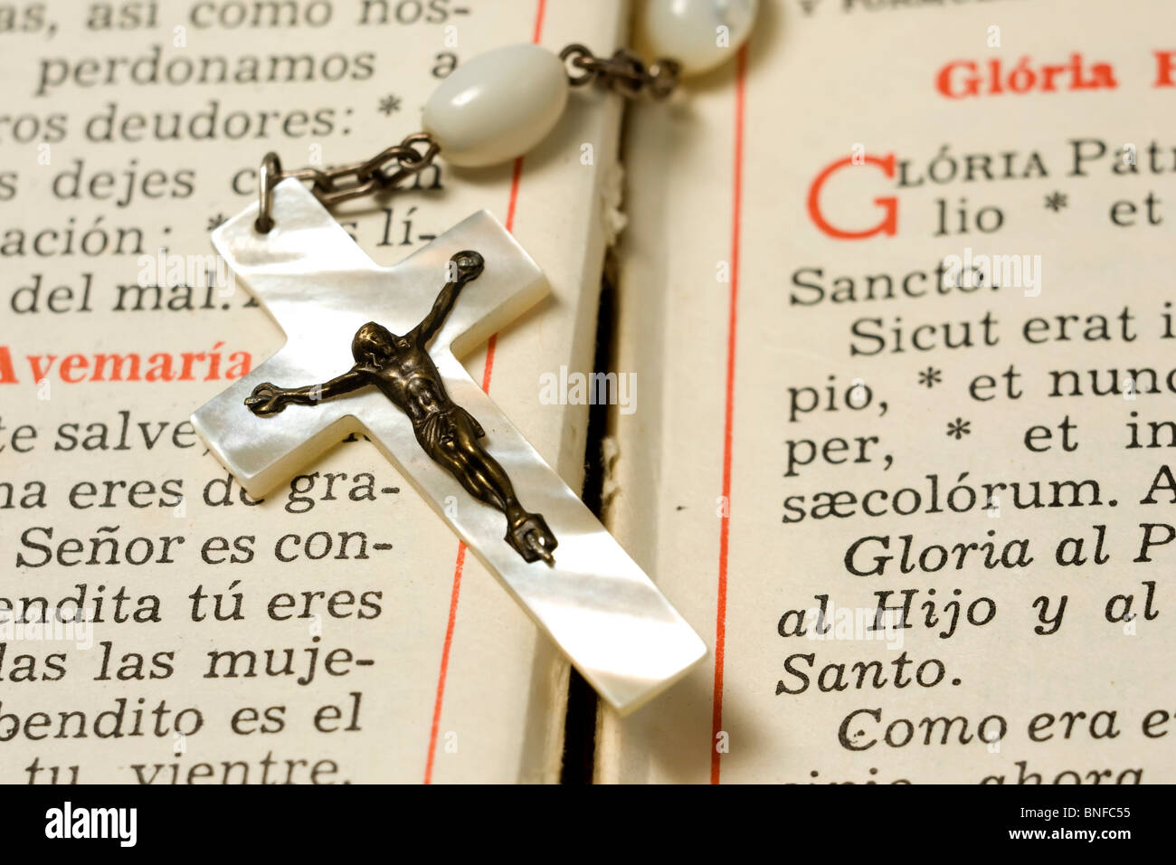 Cross and religious open book Stock Photo - Alamy