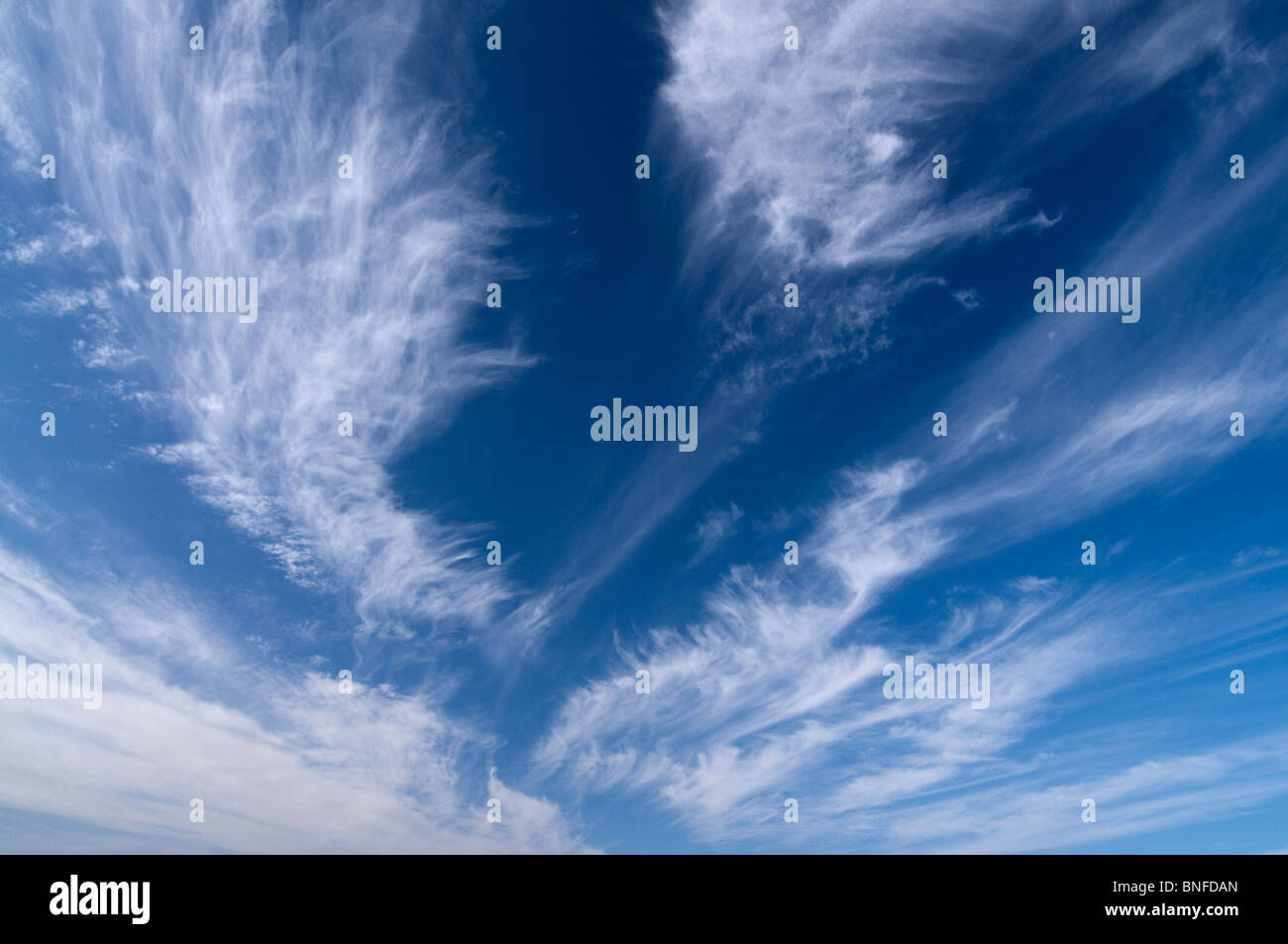 High level Cirrus clouds with a Blue Sky Stock Photo - Alamy