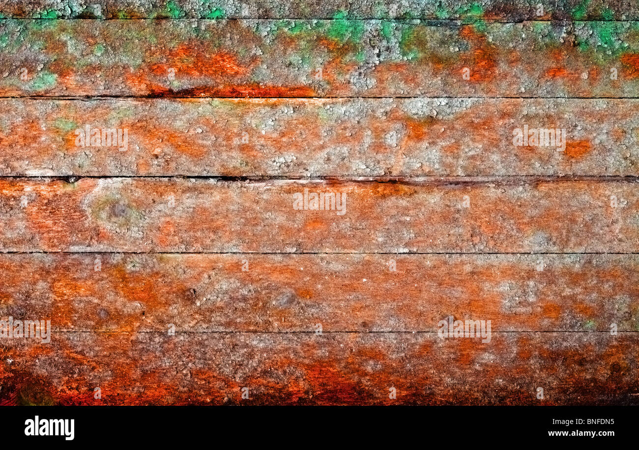 Very old rotten boards with stains of different color - a background in ...
