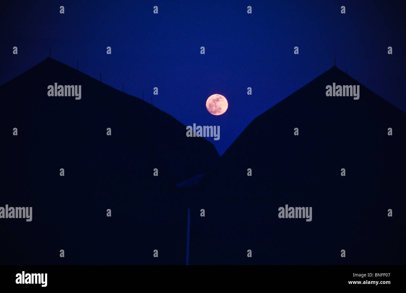 Blue sky moon glow Stock Photo - Alamy