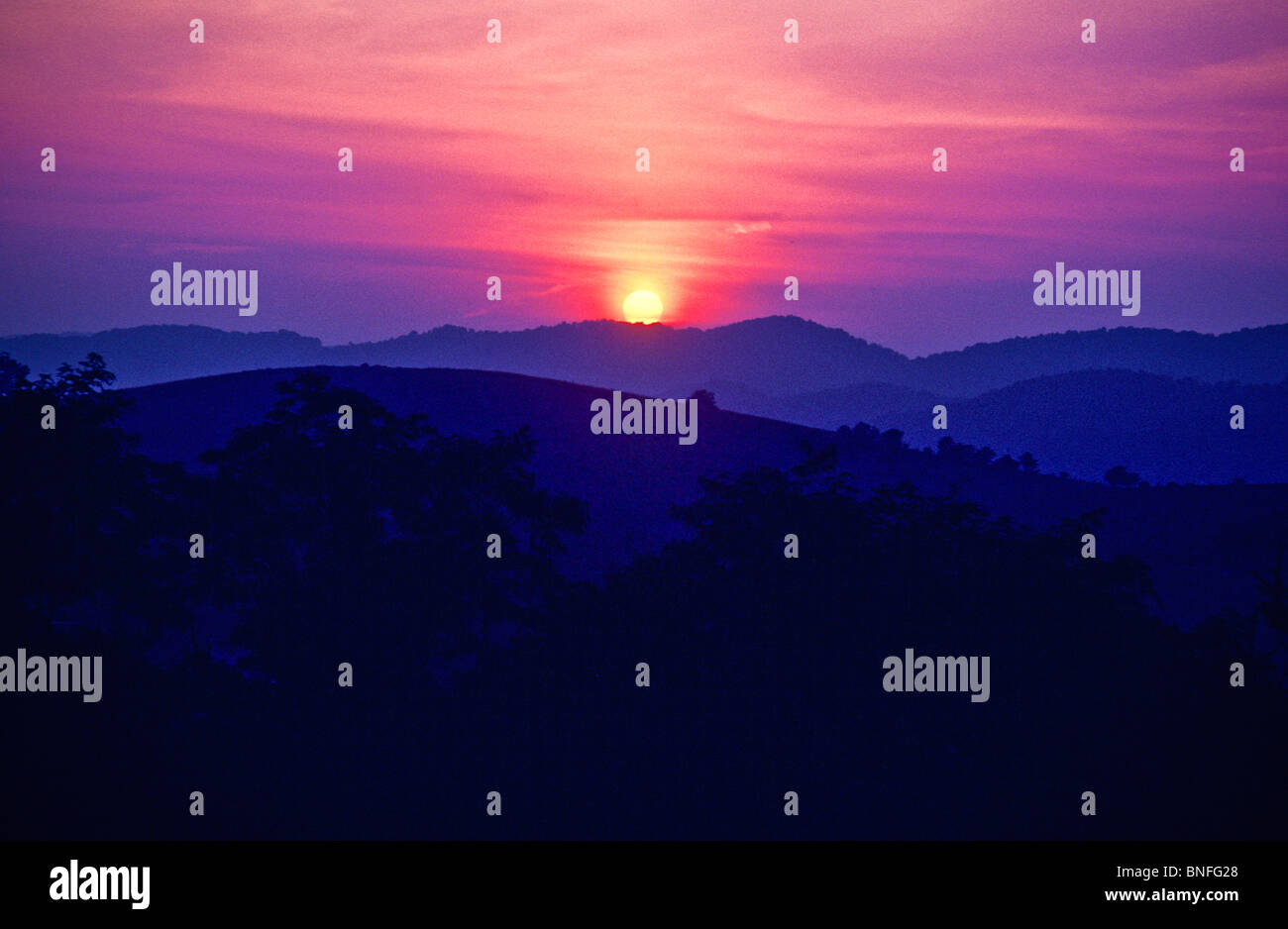 cloudy skies bright red sunset over NH mountains copy space Stock Photo ...