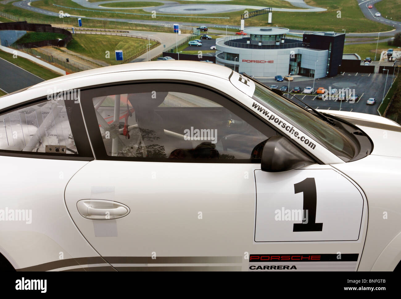 Porsche 911 in front of test track graphic on the display stand at the ...
