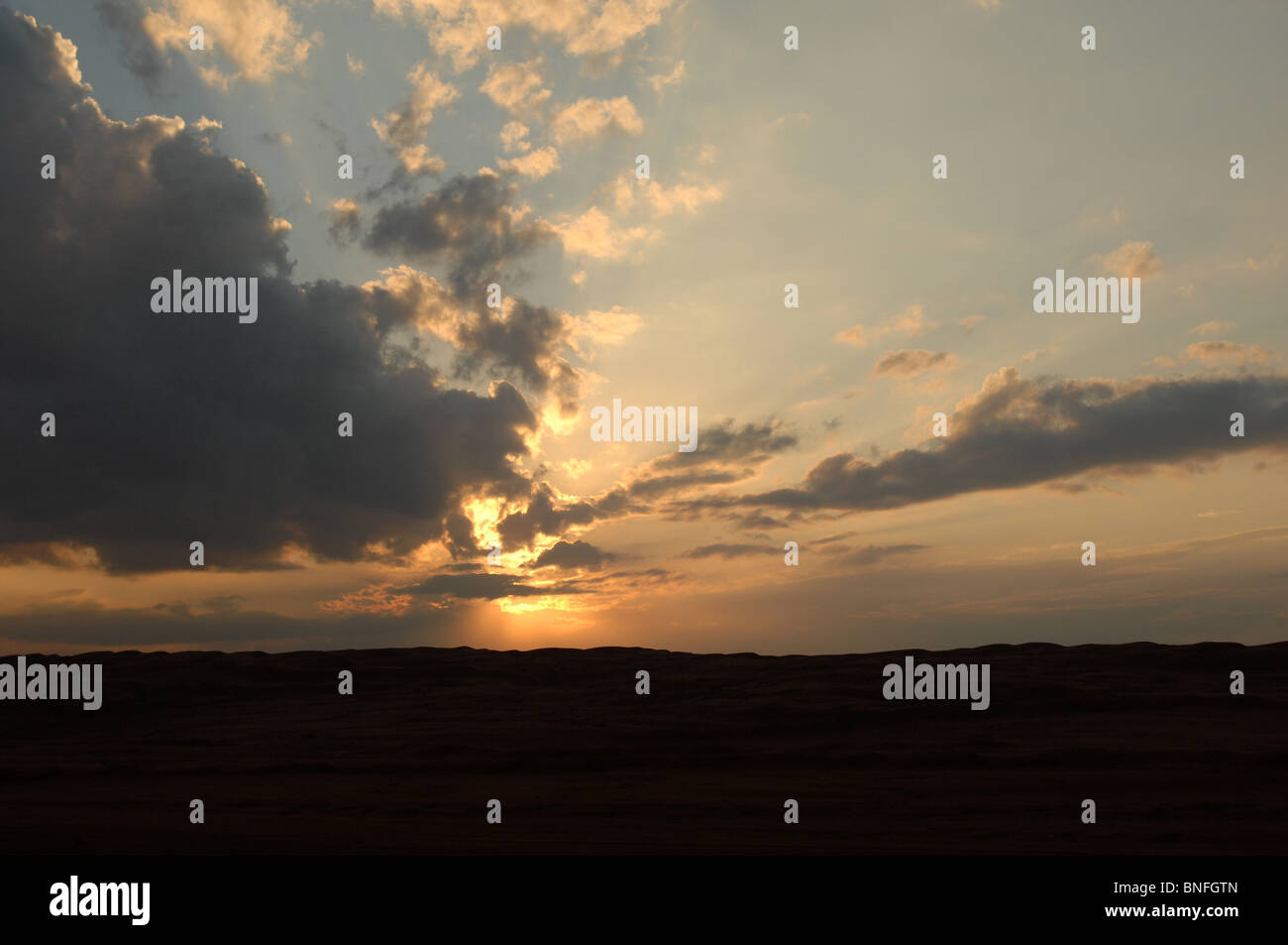 Sunset on Oman Desert Stock Photo - Alamy