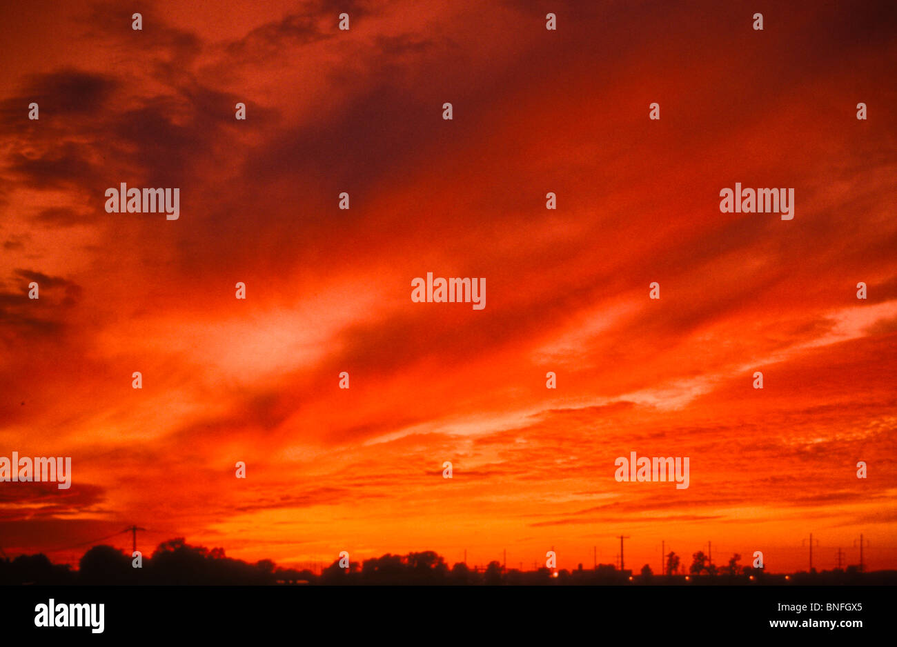 cloudy skies bright red sunset Stock Photo - Alamy