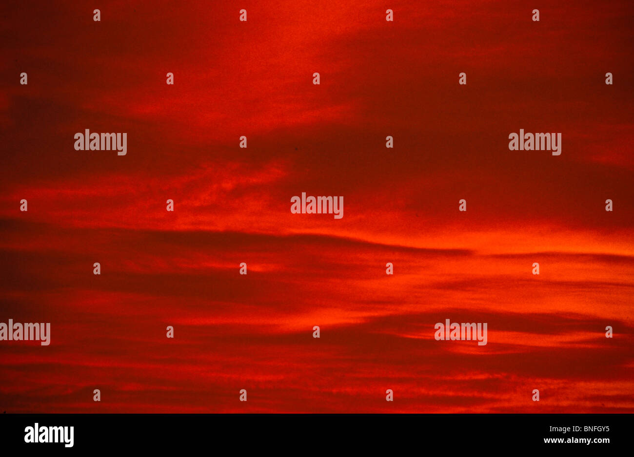 cloudy skies bright red sunset Stock Photo - Alamy