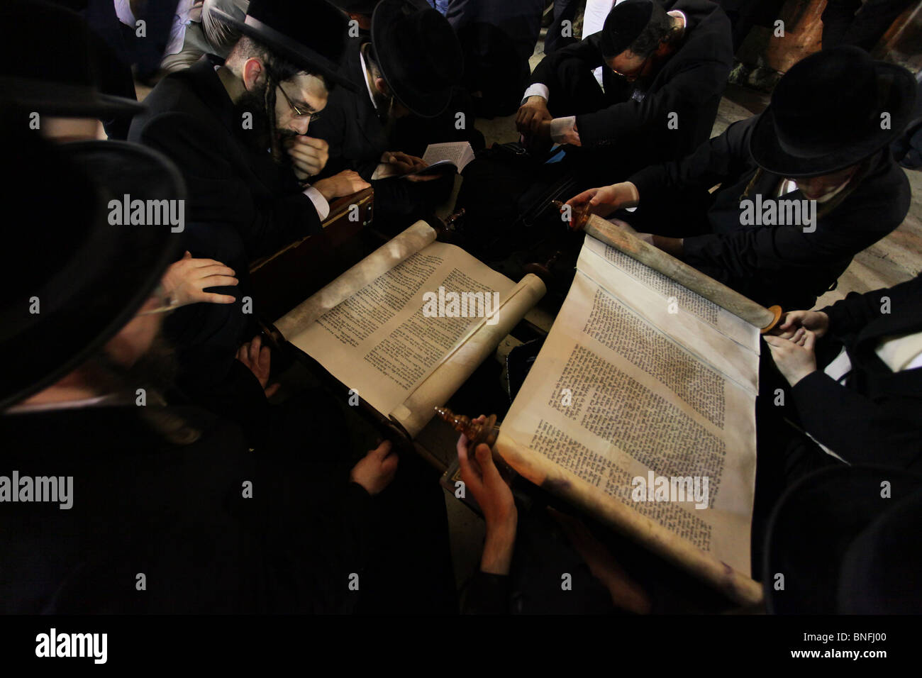 Ultra Orthodox Jews read from a Torah scroll the biblical Book of ...
