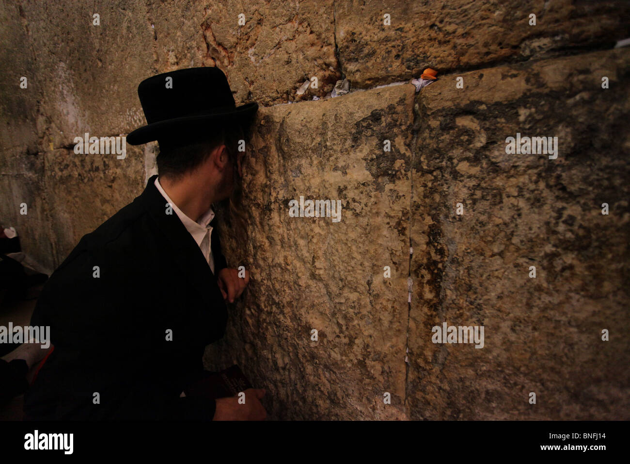 Ultra orthodox Jewish men mourning in the Western or wailing wall on ...