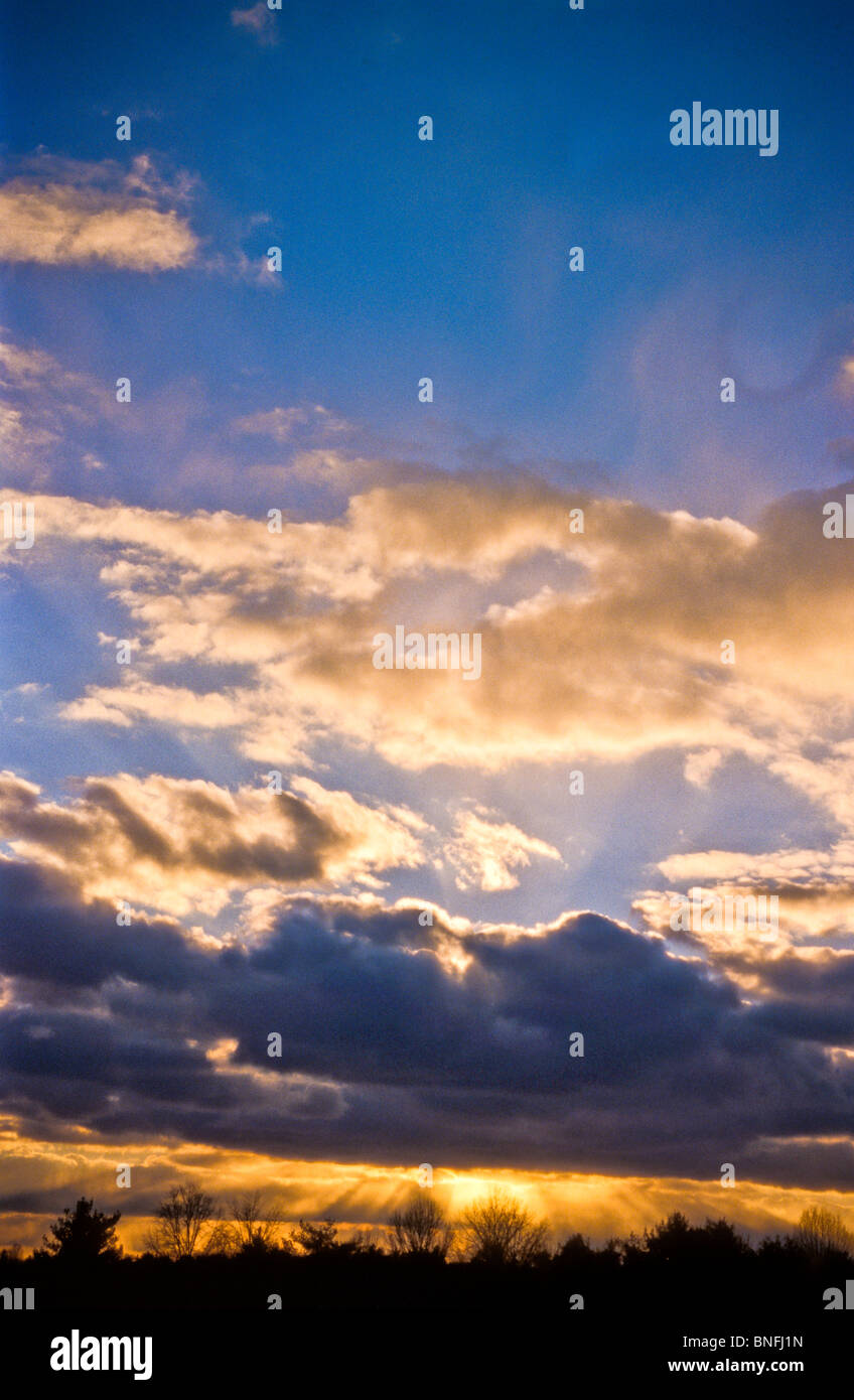 cloudy skies warm sunset late afternoon copy space Stock Photo - Alamy