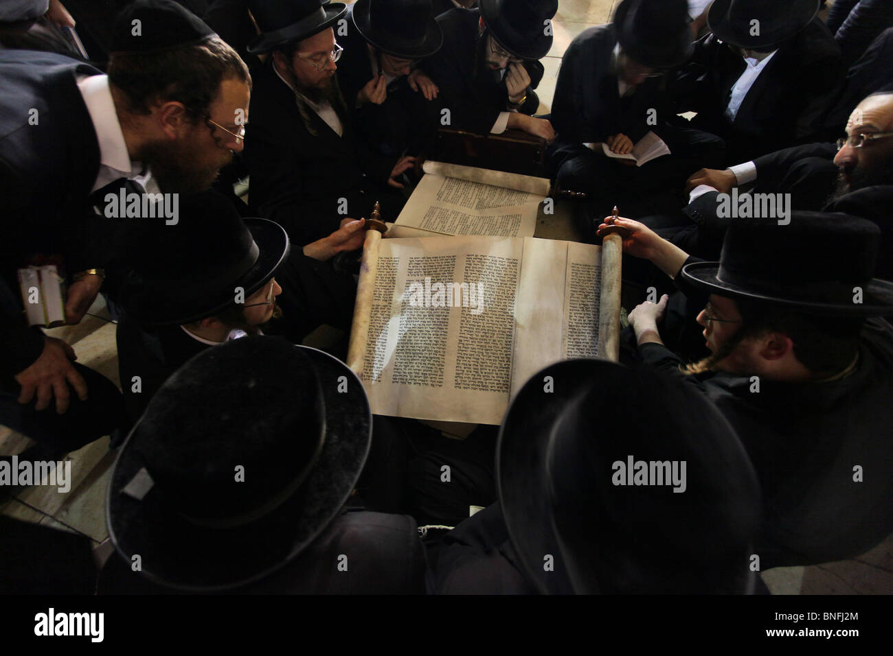 Ultra Orthodox Jews read from a Torah scroll the biblical Book of ...