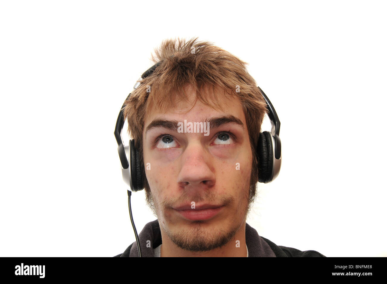 Young man thinking about music isolated on white background Stock Photo ...