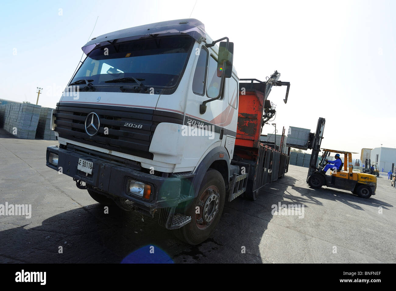 forklift lifting cement blocks Stock Photo - Alamy