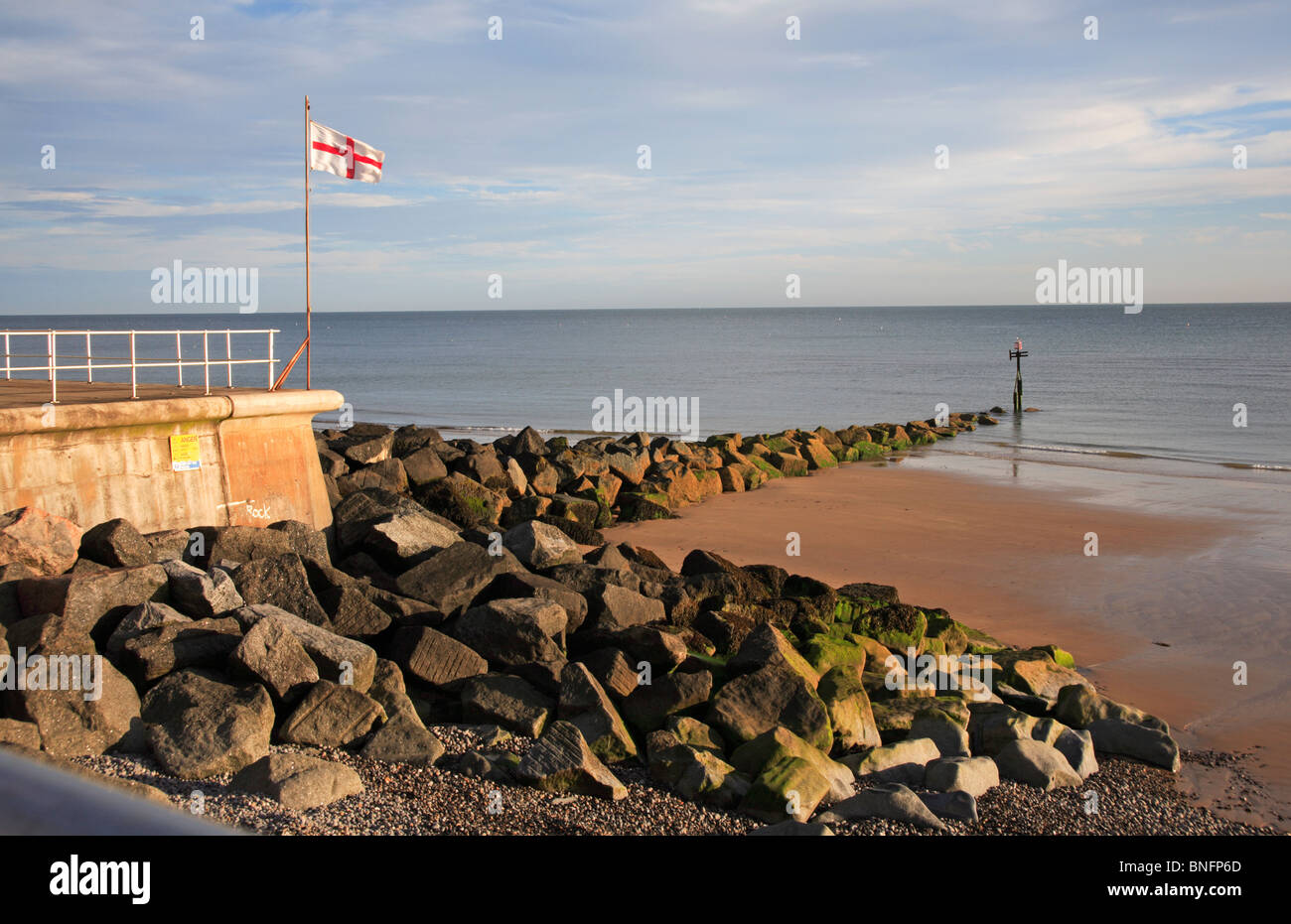 Rock breakwater and rocks reinforcing the sea wall at Sheringham ...