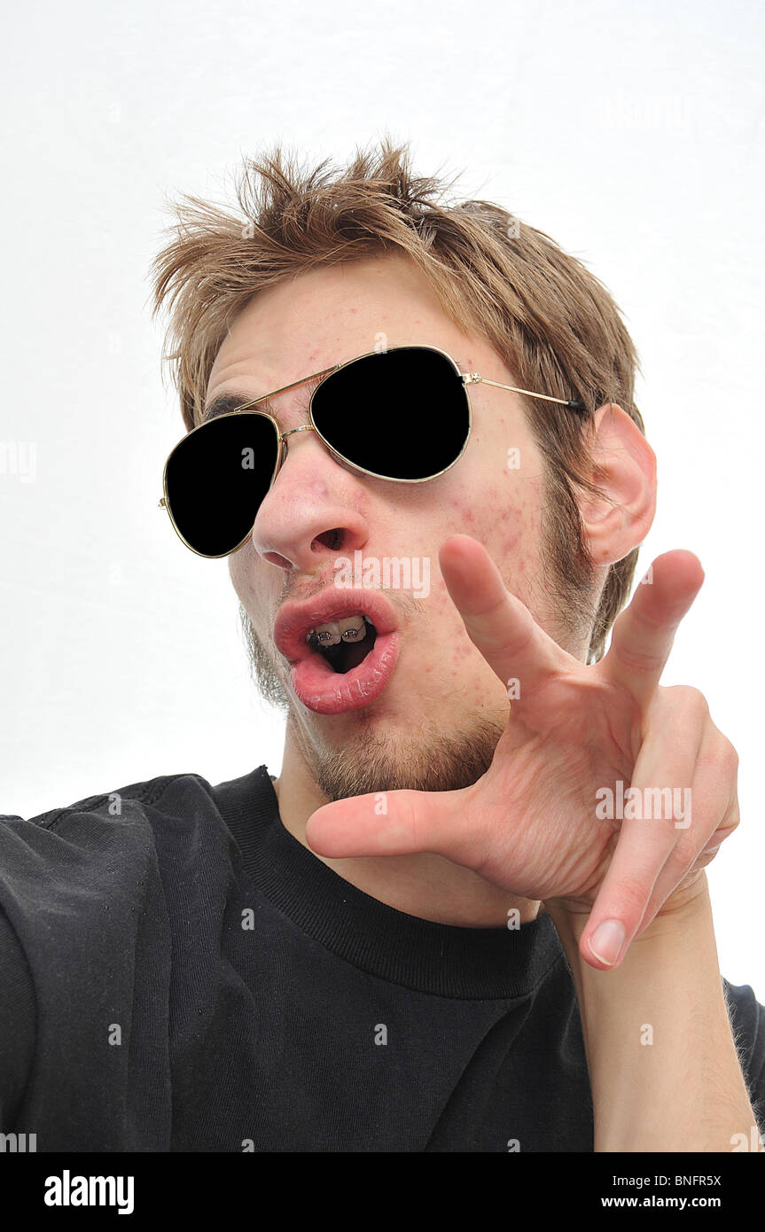 Hyped up young adult wearing aviators isolated on white background ...