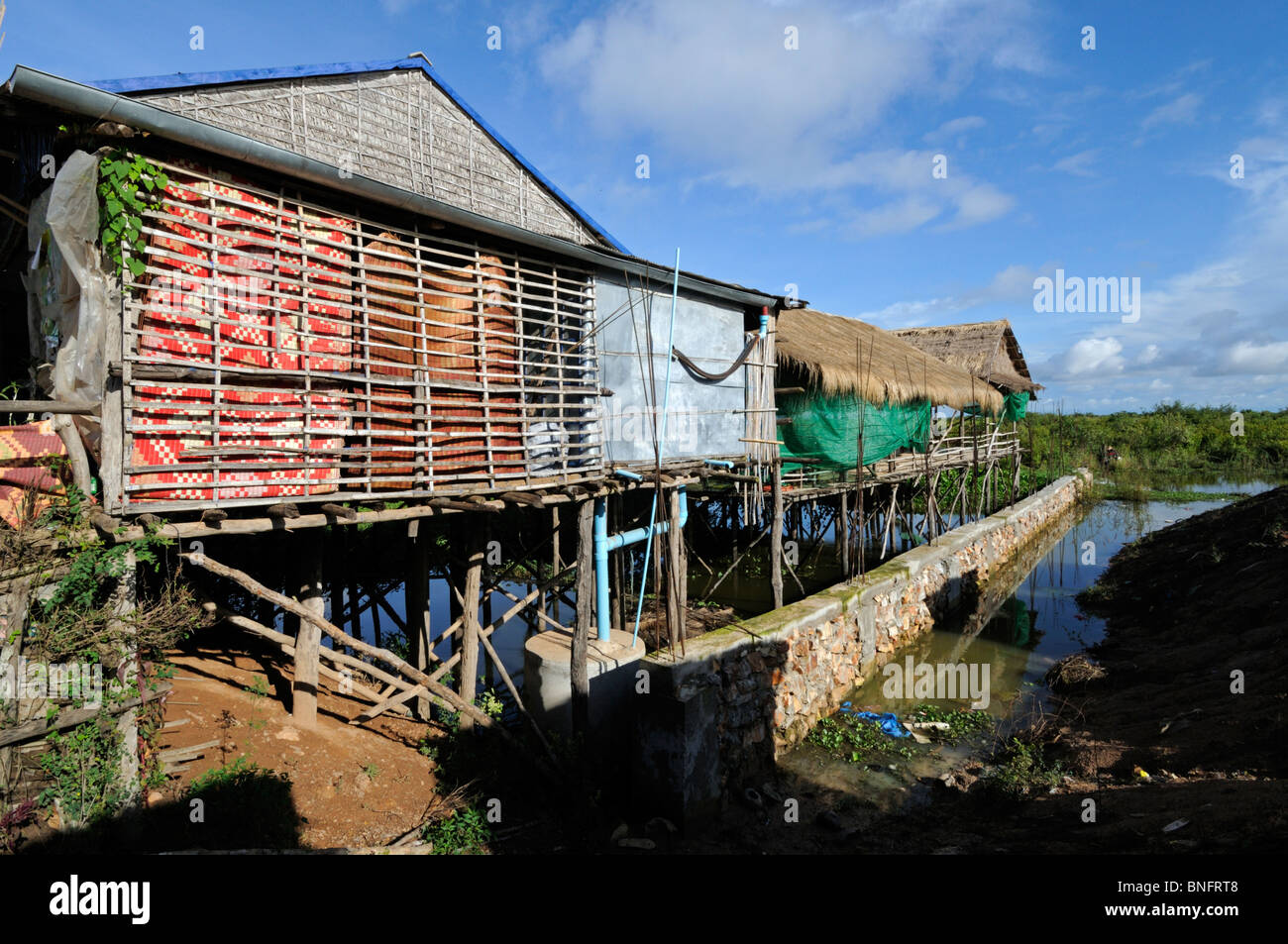 Cambodian village on the bank of lake Stock Photo - Alamy