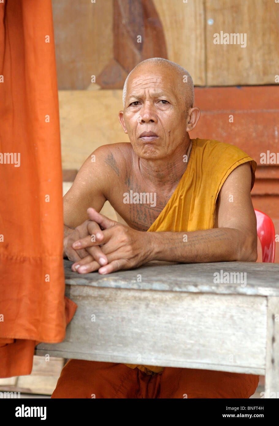 Buddhist monk in orange robes, Angkor, Cambodia Stock Photo - Alamy