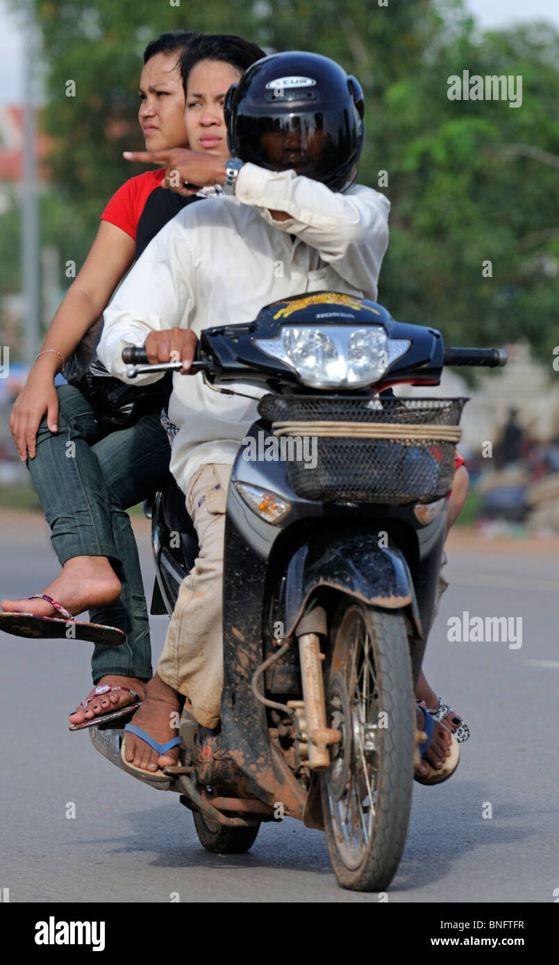 Three People On One Motorbike High Resolution Stock Photography and ...
