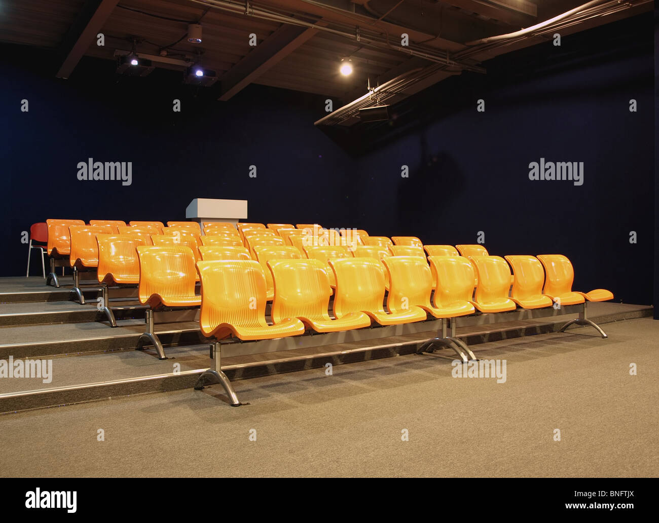 A modern lecture hall or auditorium with rows of seats Stock Photo - Alamy