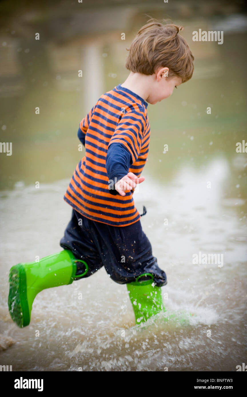 Boy playing in a puddle, San Diego, California, USA Stock Photo - Alamy