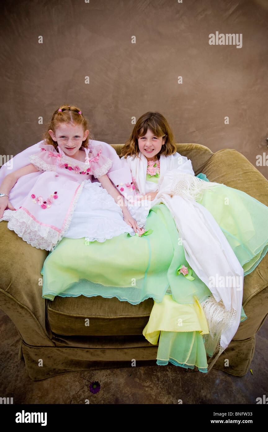 Portrait of two girls in fancy dresses, San Diego, California, USA ...