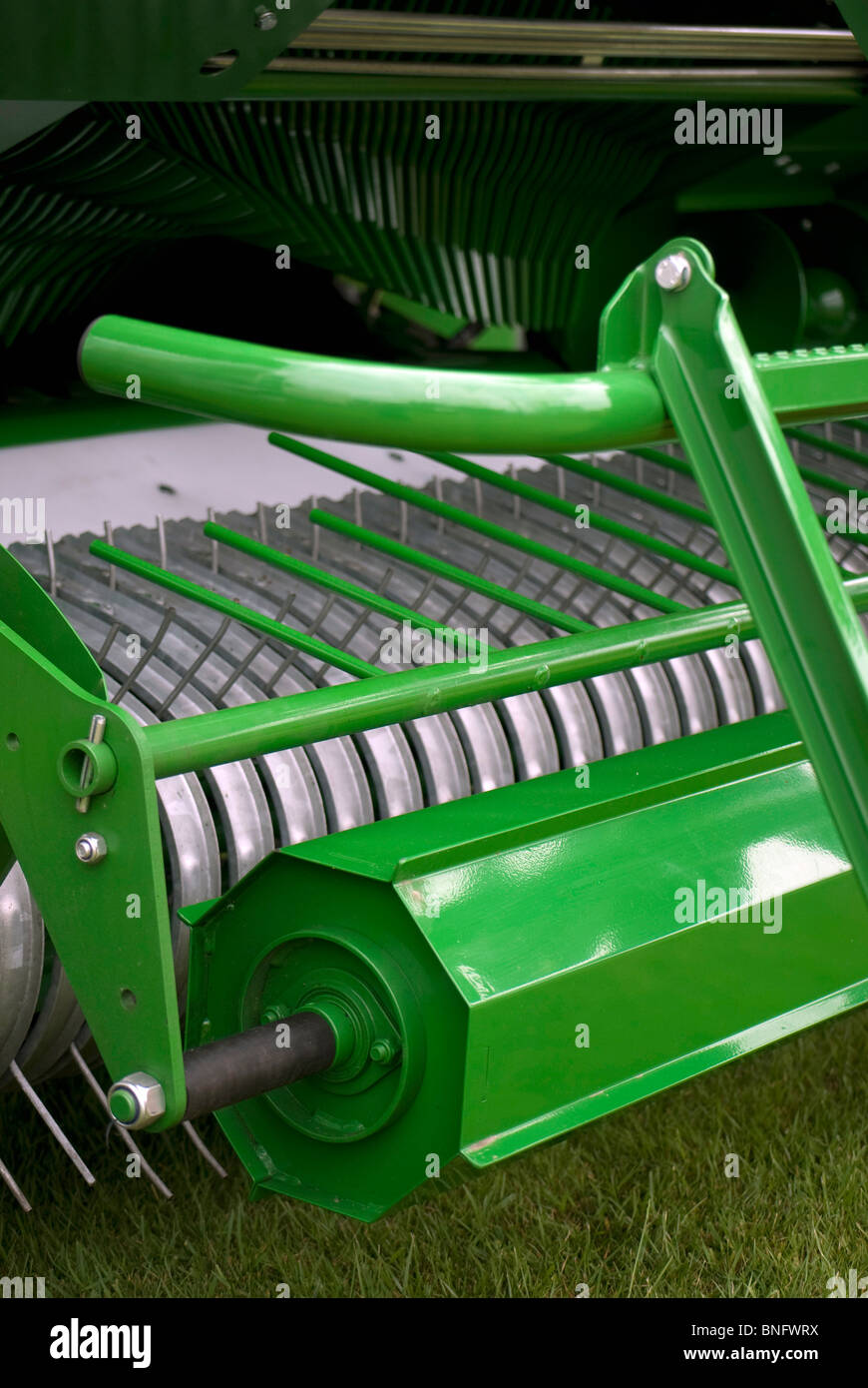 Revolving tines on an agricultural aerator Stock Photo - Alamy