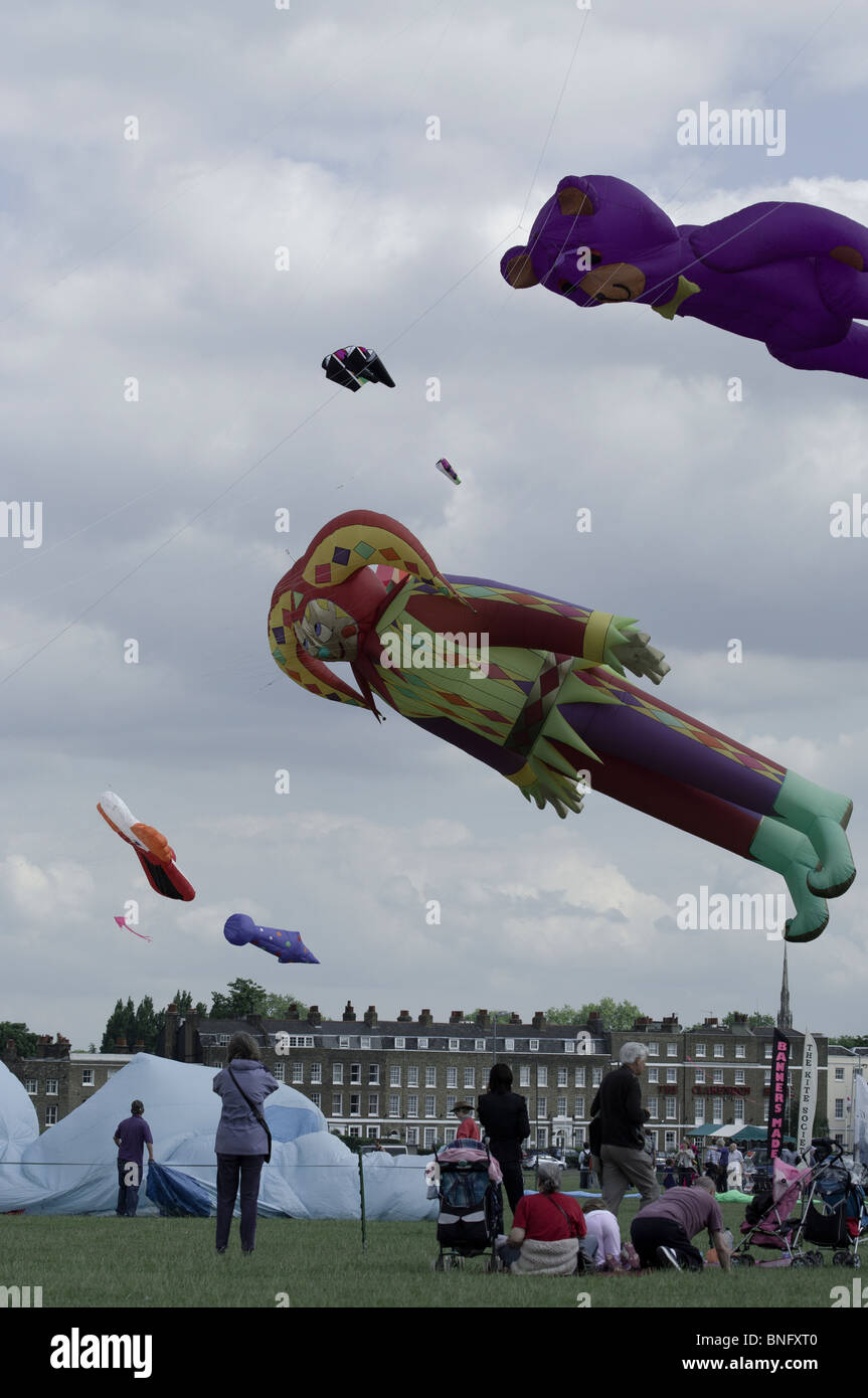 Children and parents watch a display of large kites on Blackheath ...