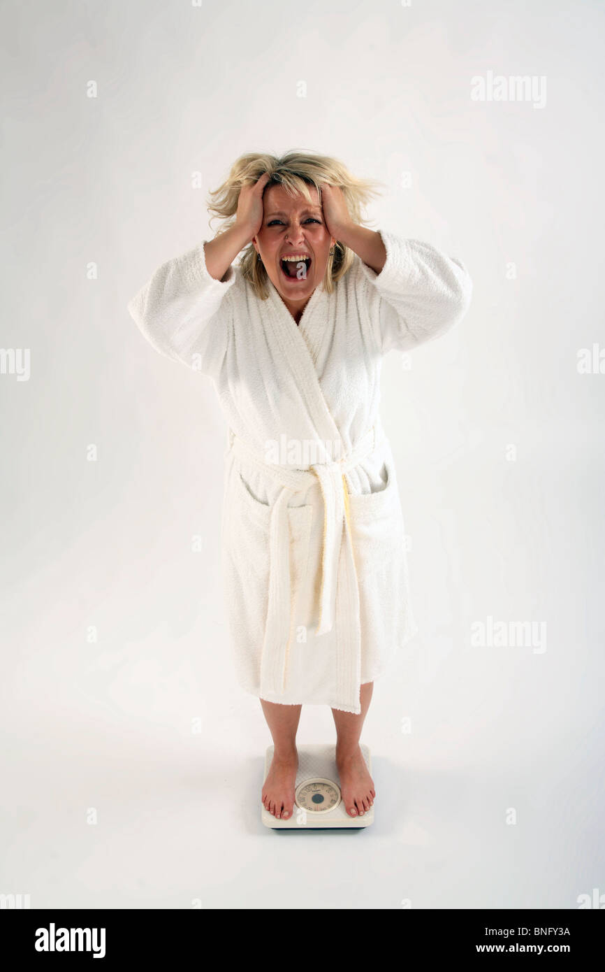 Woman on scales Stock Photo - Alamy