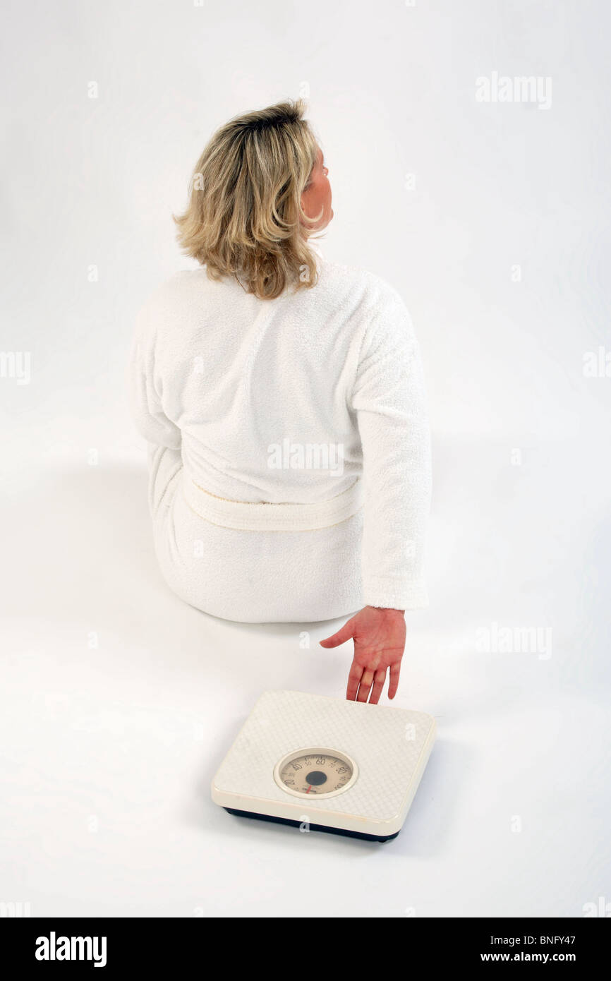Woman putting aside scales Stock Photo - Alamy