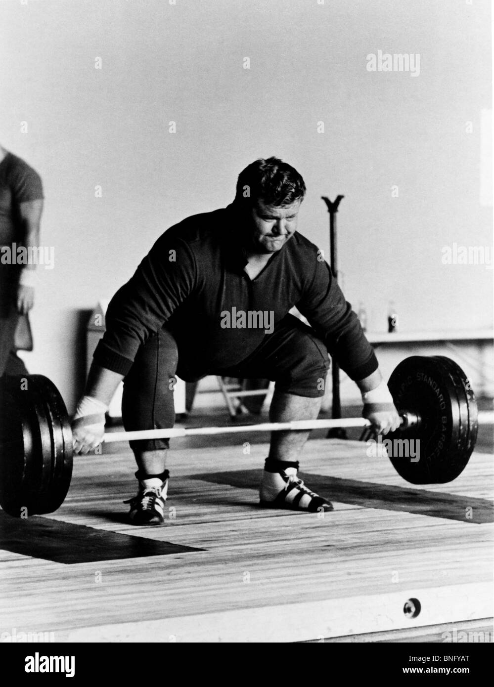Mid adult man weightlifting Stock Photo - Alamy
