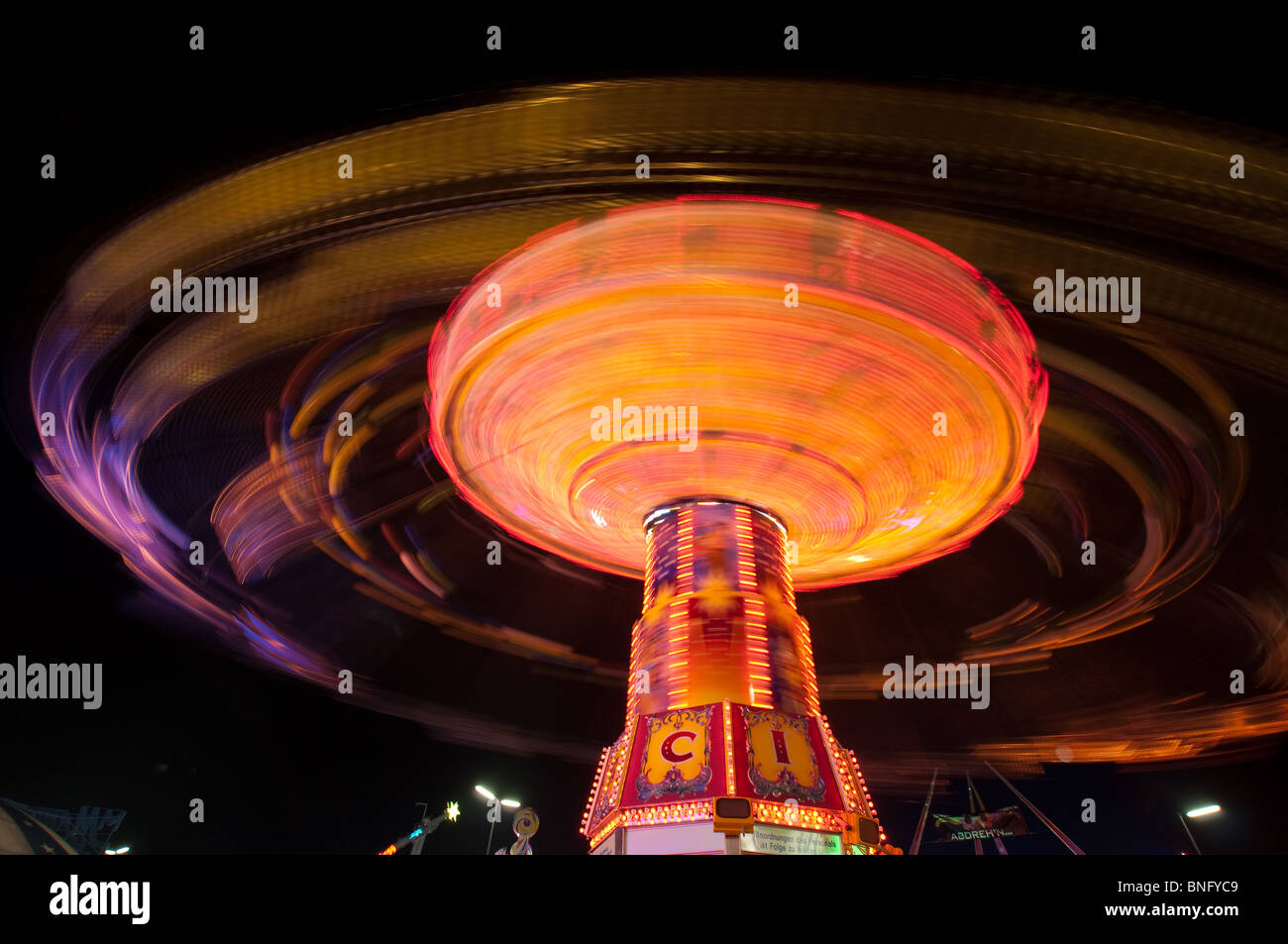 Rotating Carousel on the Munich Oktoberfest by Night Stock Photo - Alamy