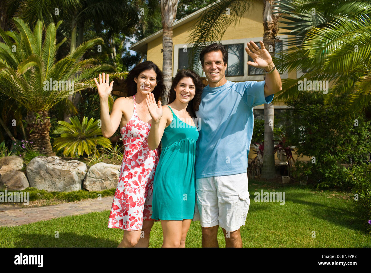 Mother daughter waving hands camera hi-res stock photography and images ...