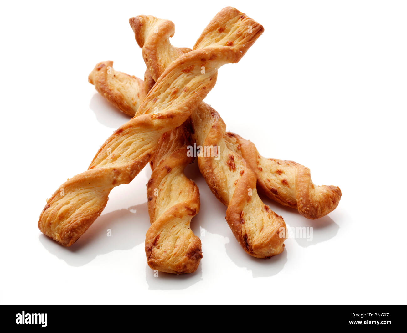 Cheese twists straws on a white background Stock Photo - Alamy