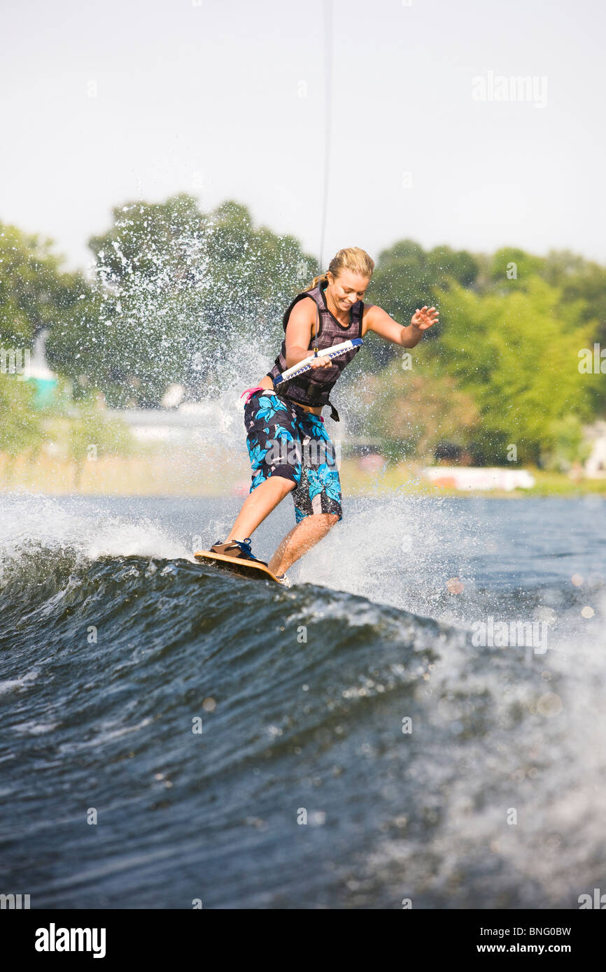 Young woman wakeboarding in the sea Stock Photo - Alamy