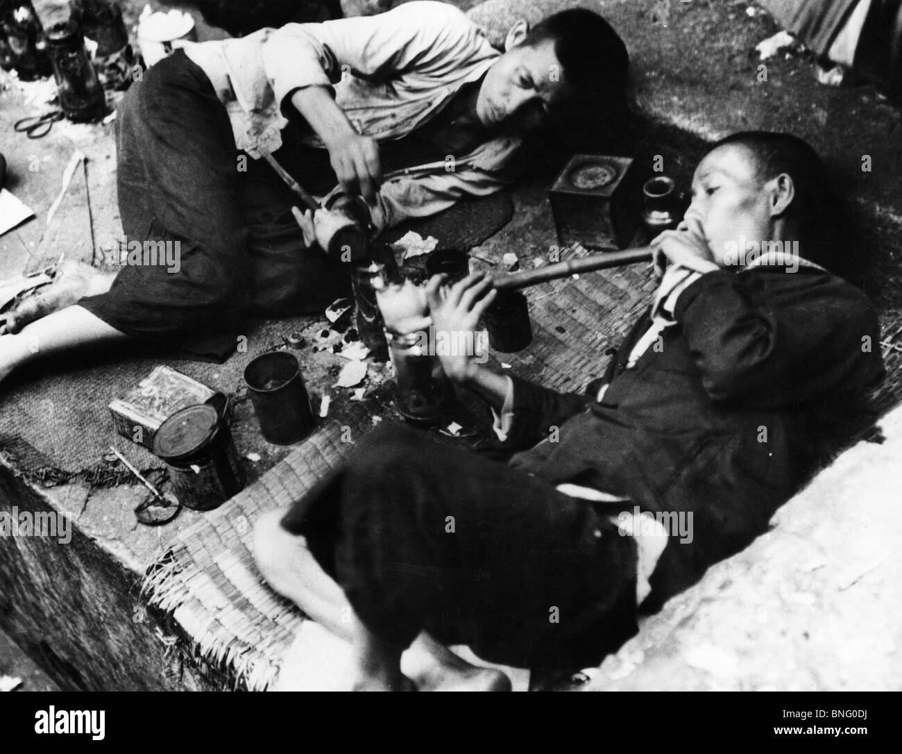 China, Hong Kong, High angle view of two mature men smoking opium Stock ...
