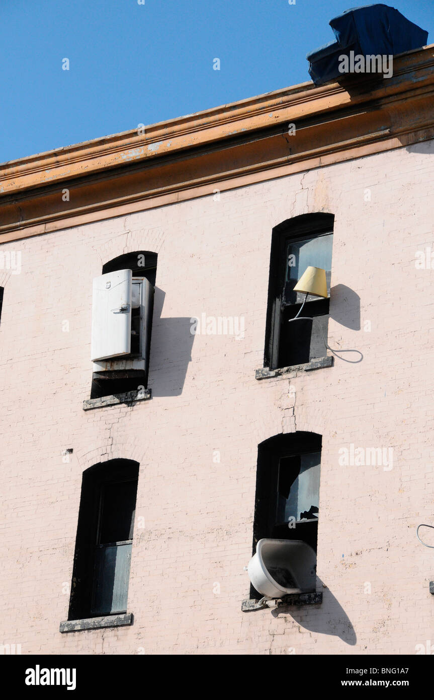 Household objects sticking out from the windows of a building, San ...
