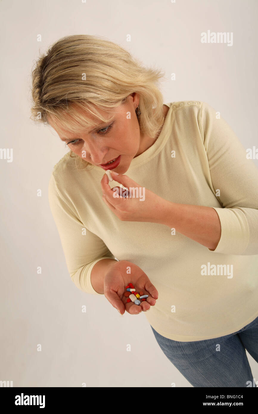 Woman with pills Stock Photo - Alamy