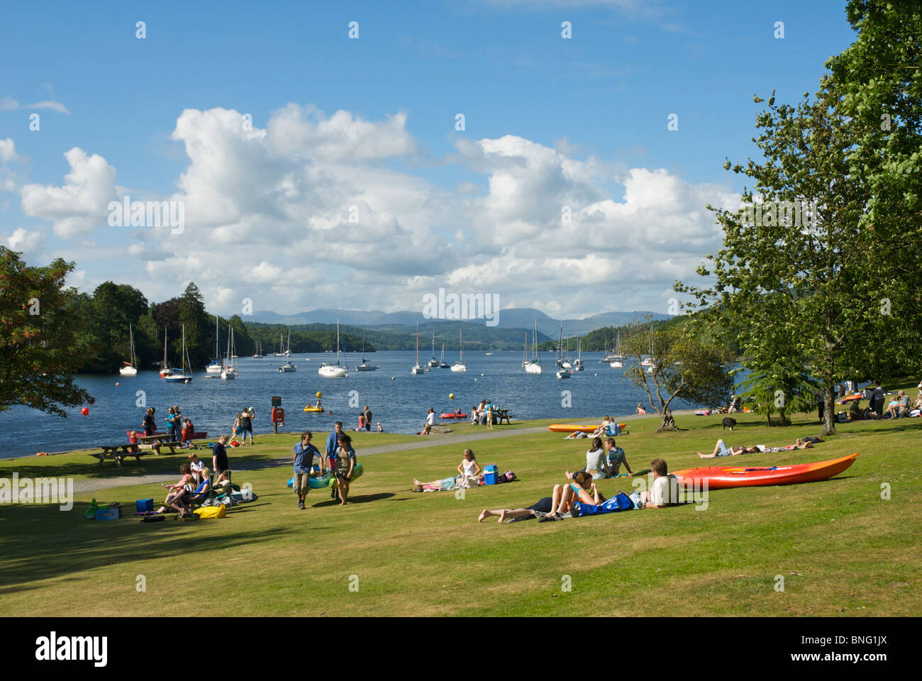 People relaxing at Fell Foot Park, on the shore of Lake Windermere ...