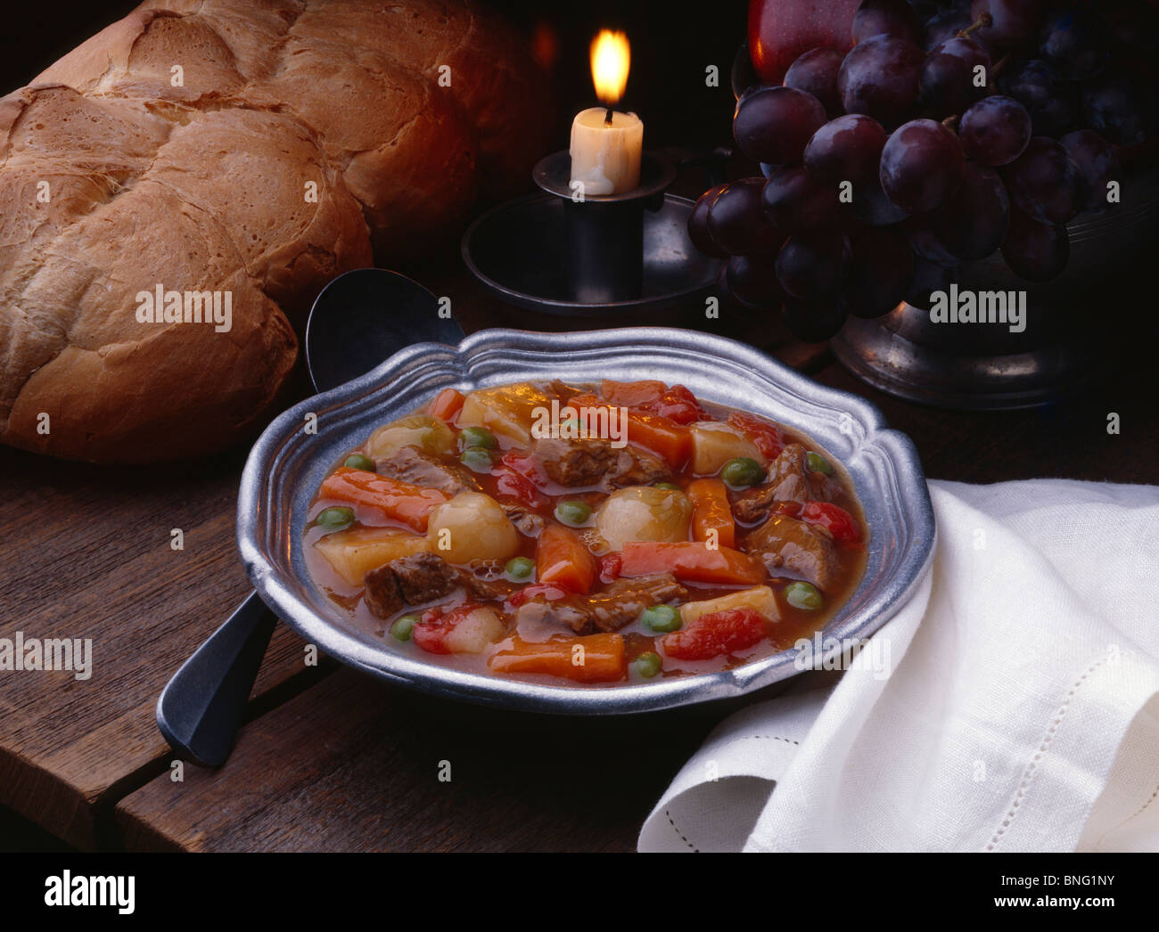 Close-up of a beef stew on a bowl with red grapes Stock Photo - Alamy
