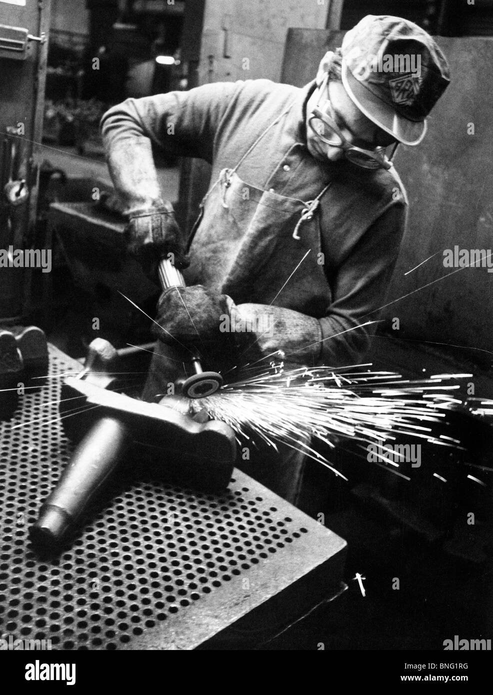 metal worker in a factory,Italy 70's Stock Photo - Alamy