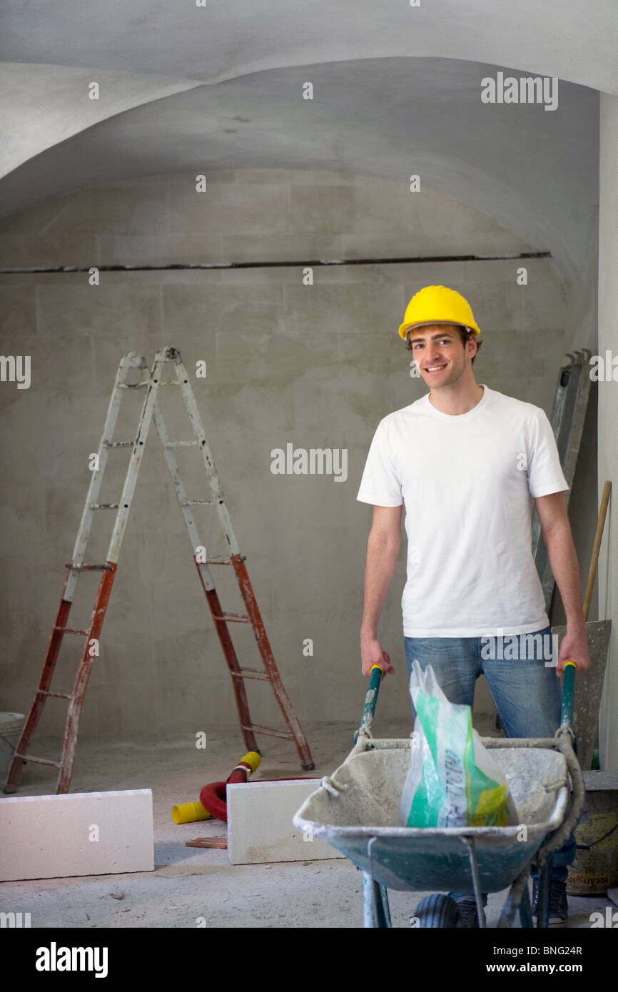 mason with wheelbarrow Stock Photo - Alamy