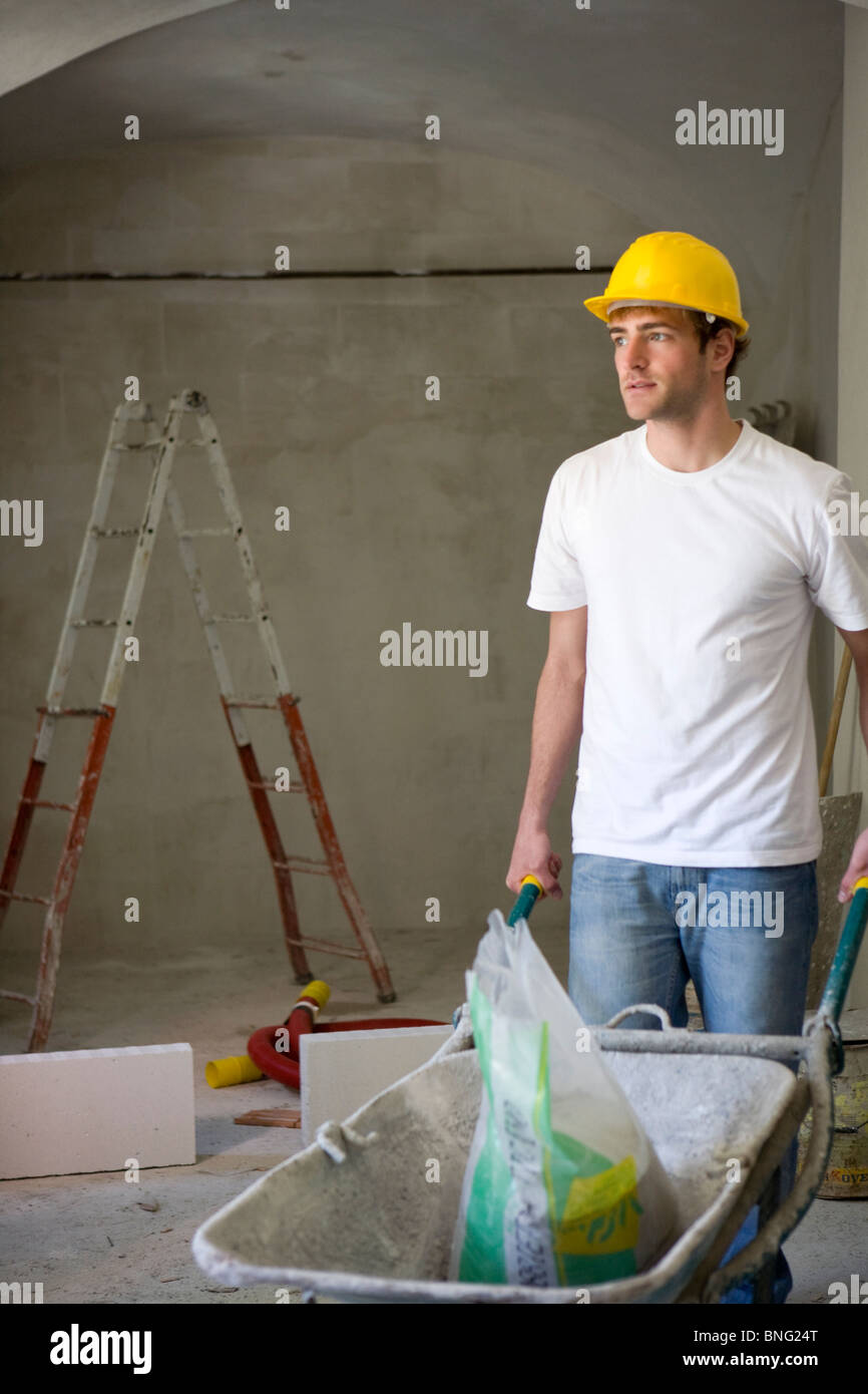 mason with wheelbarrow Stock Photo - Alamy