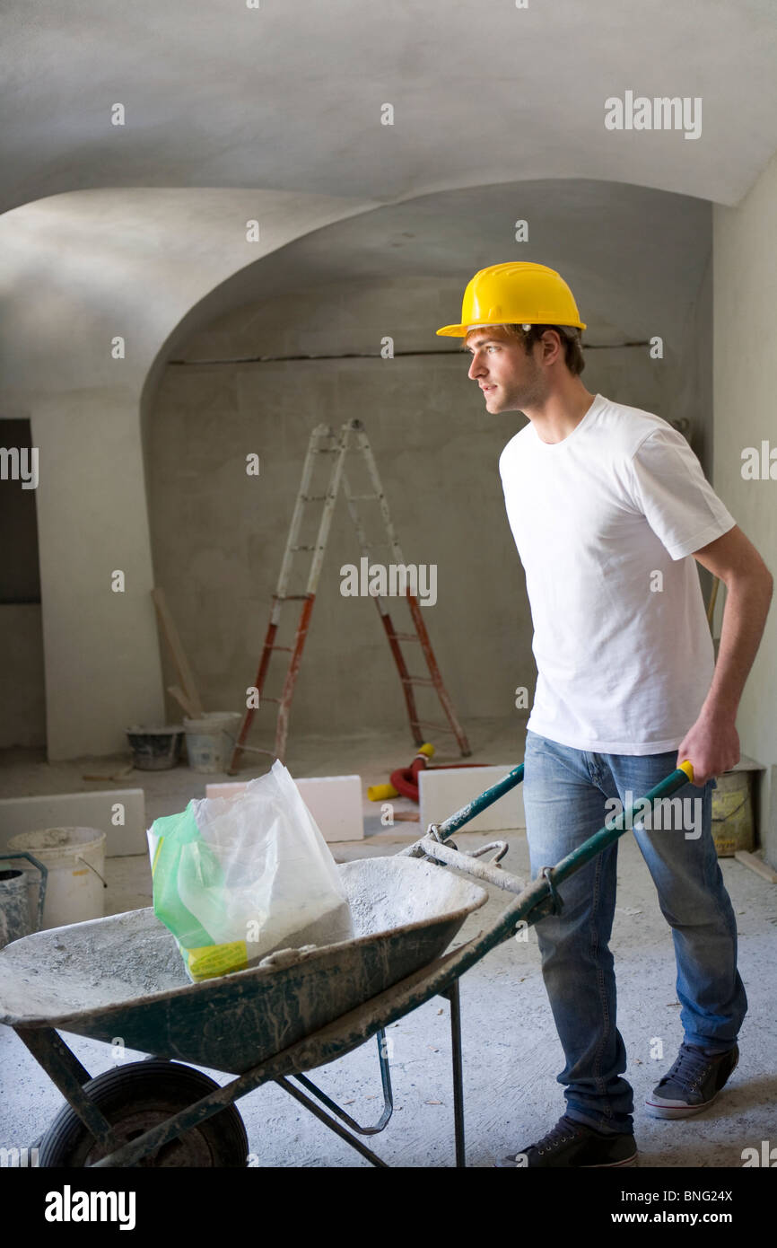 mason with wheelbarrow Stock Photo - Alamy