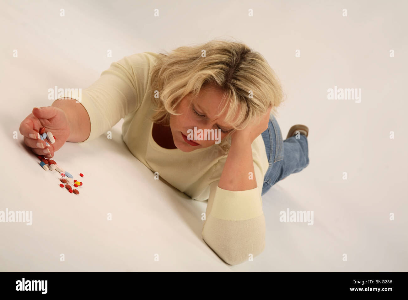 Woman with pills Stock Photo - Alamy
