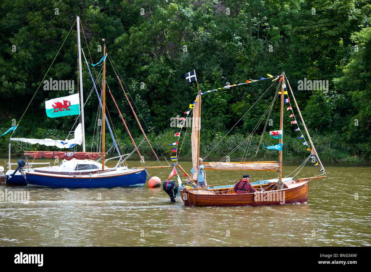 Wooden boat with buntings and welsh flags on Pembroke pond during ...