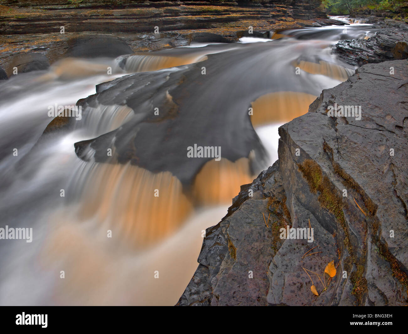 Waterfall on a river, Presque Isle River, Upper Peninsula, Michigan ...