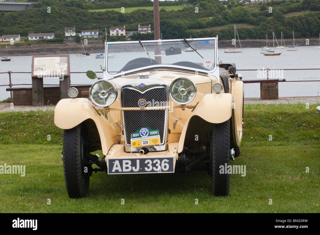 Cream old Vintage car, front radiator grille, chrome and headlights ...