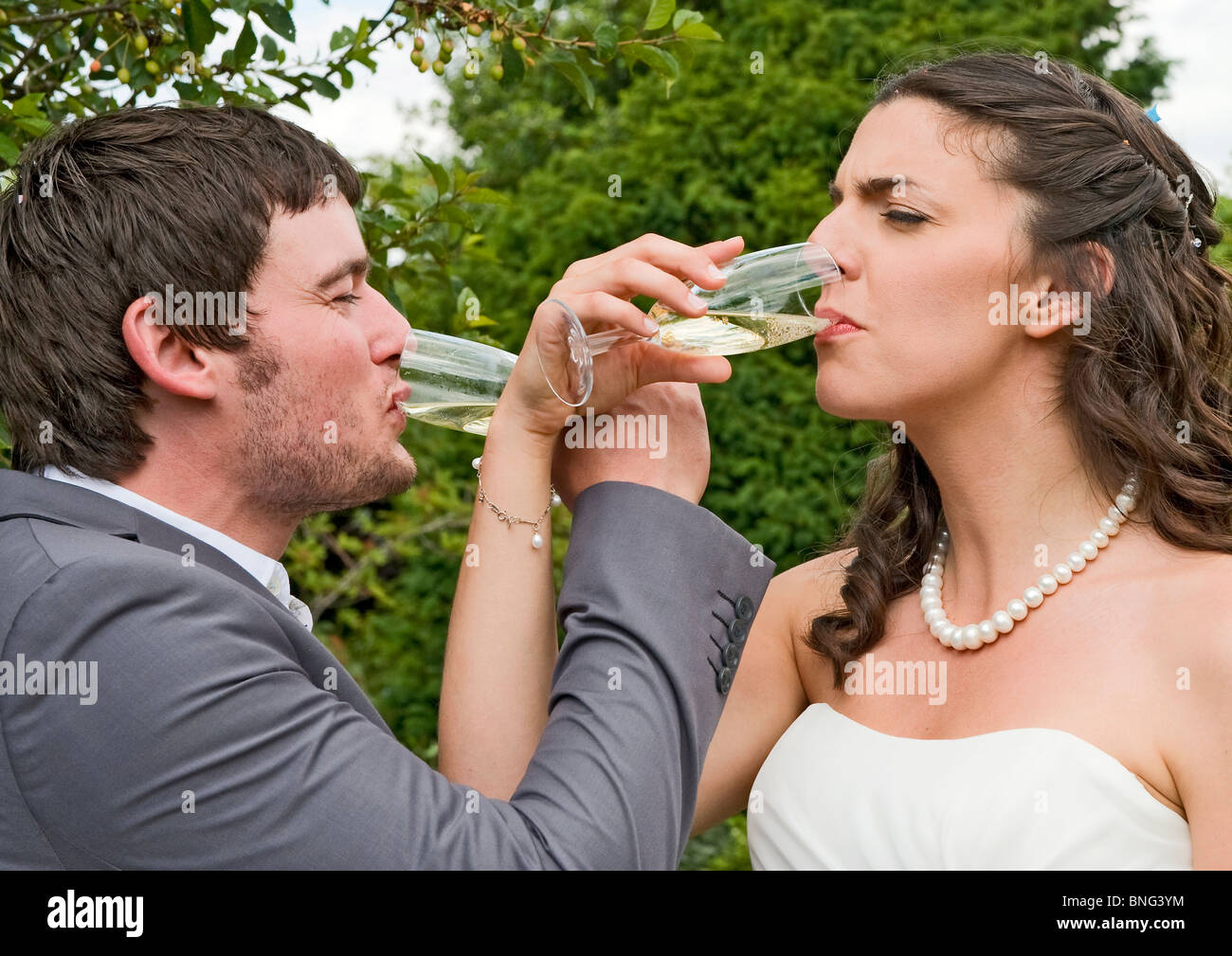 Bride and Groom Drinking Champagne Stock Photo - Alamy