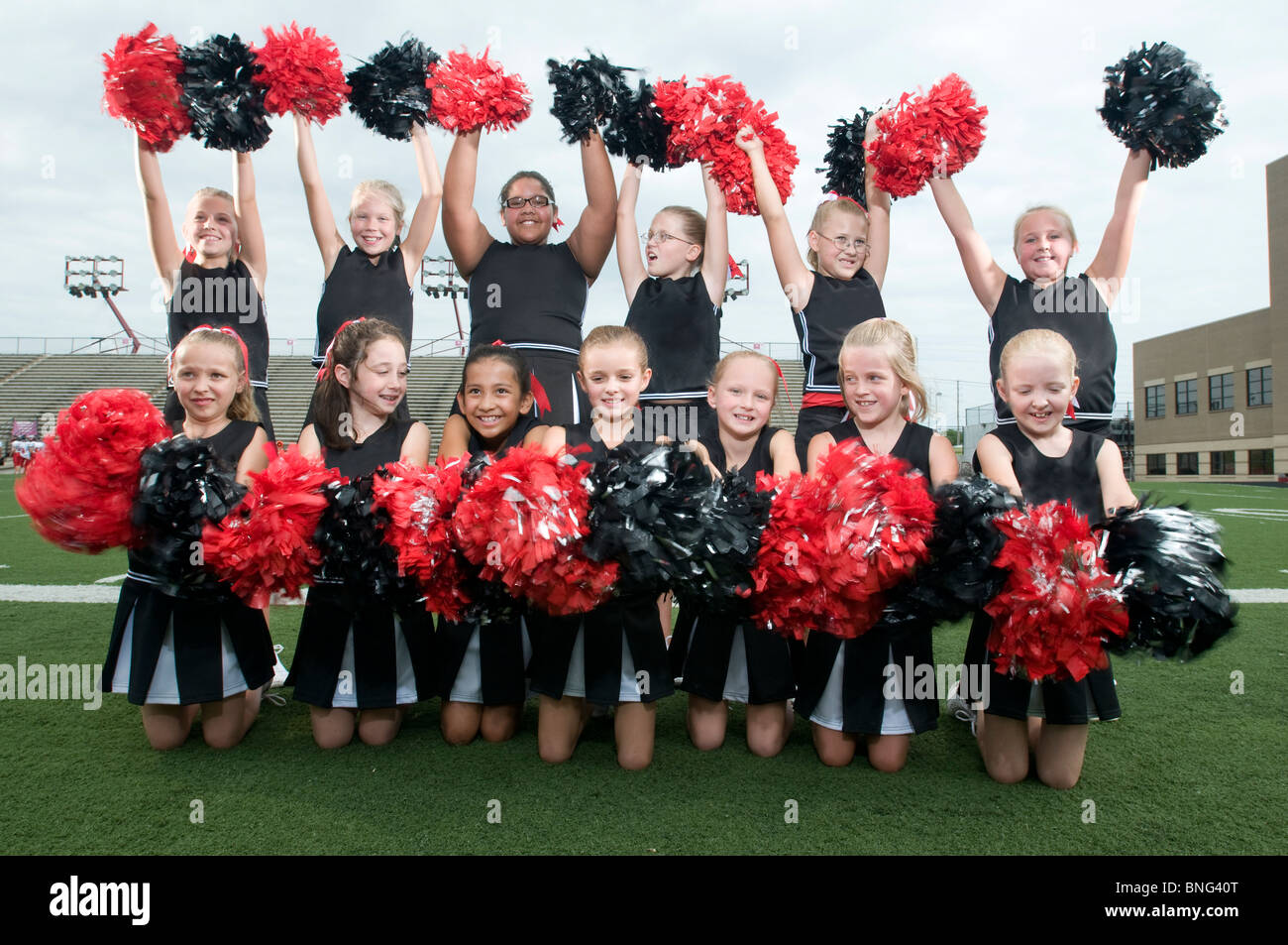 Cheerleader girls in a football stadium Stock Photo - Alamy